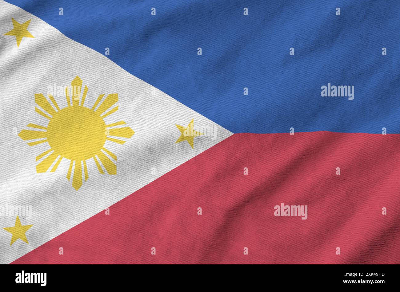 Philippines flag depicted on folded wavy fabric of old cloth close up ...