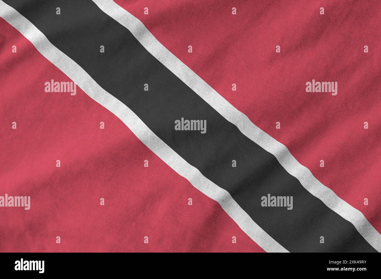 Trinidad and Tobago flag depicted on folded wavy fabric of old cloth ...