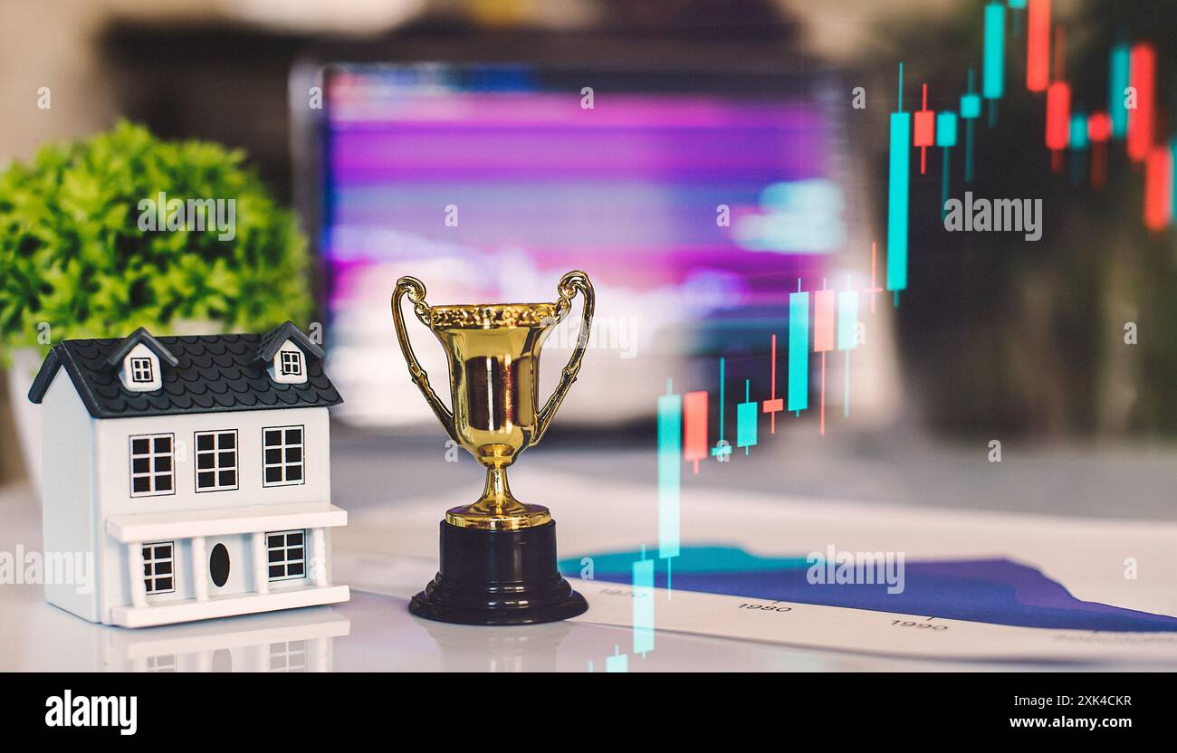 House model, pen and notepad on table with stock market chart, real ...