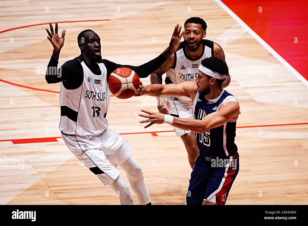 USA's Devin Booker and South Sudan's Majok Deng and Carlik Jones during ...