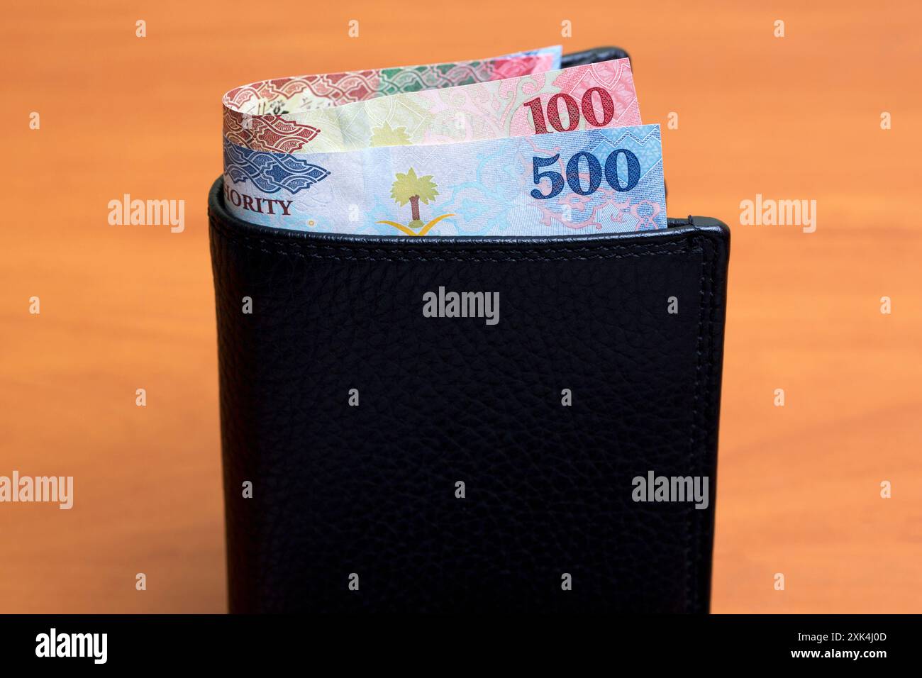 Saudi money - riyal in the black wallet Stock Photo - Alamy