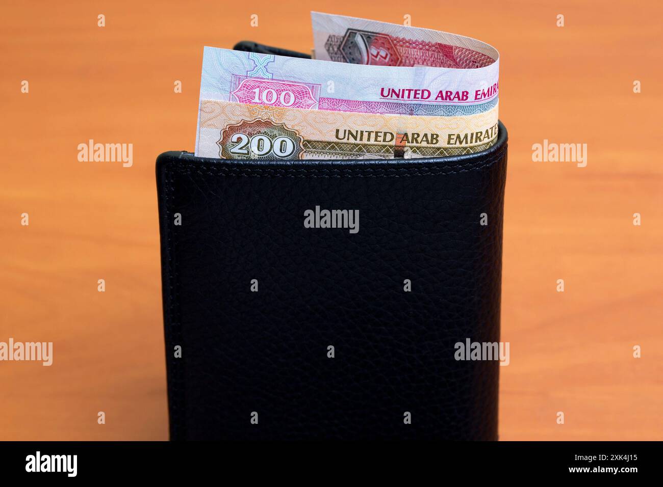 United Arab Emirates money - dirham in the black wallet Stock Photo - Alamy