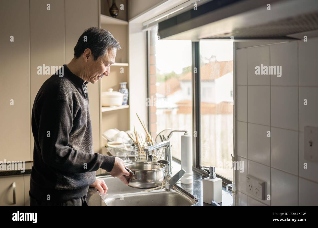 Filling water pot hi-res stock photography and images - Alamy
