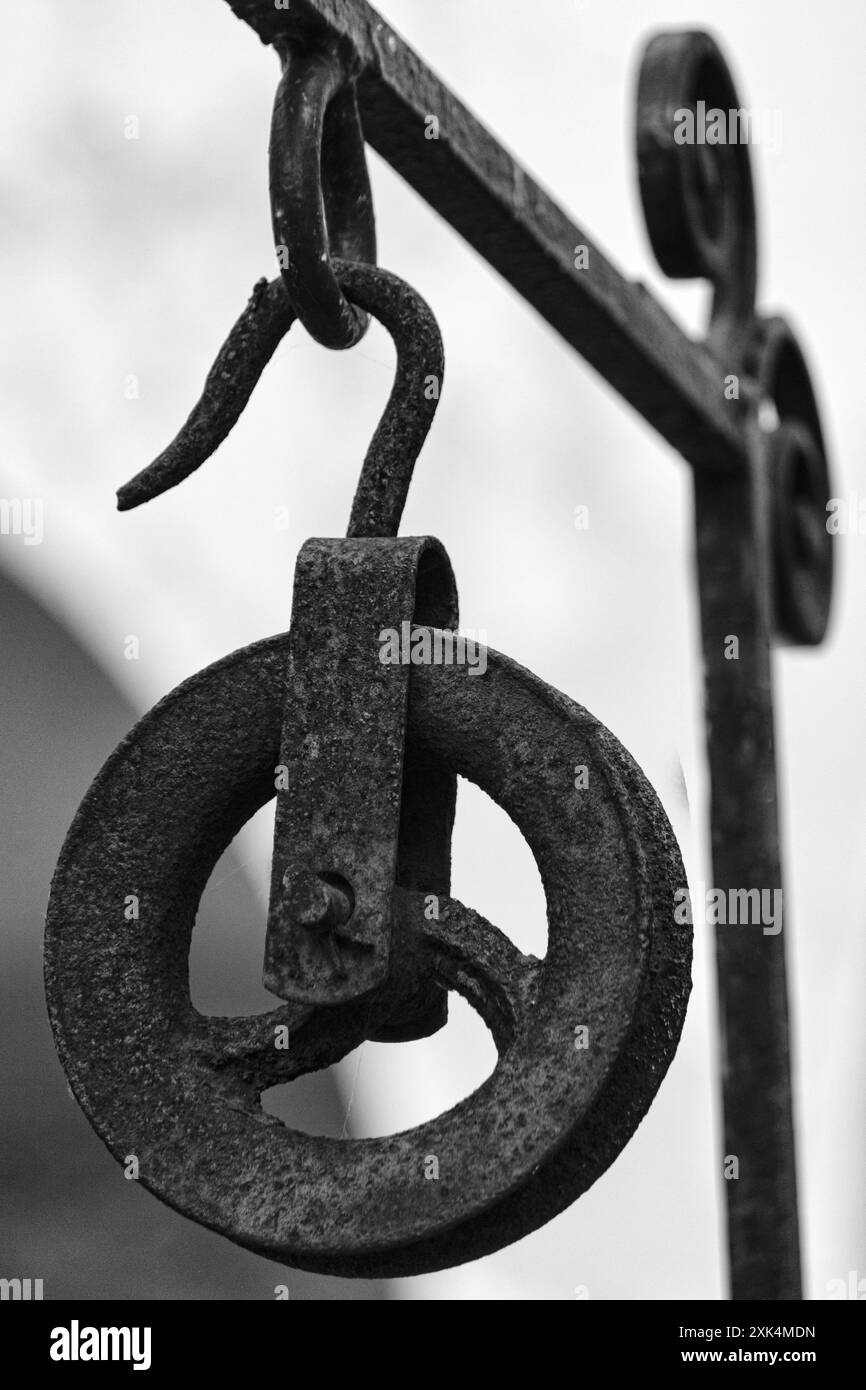 a well-old rope hanger hook in black and white Stock Photo - Alamy