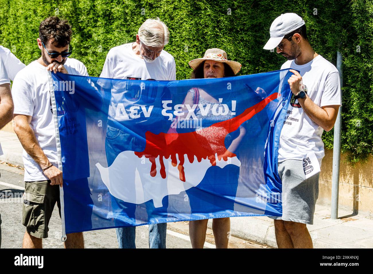 A group of Greek-Cypriots and Turkish-Cypriots re holding a blooded ...