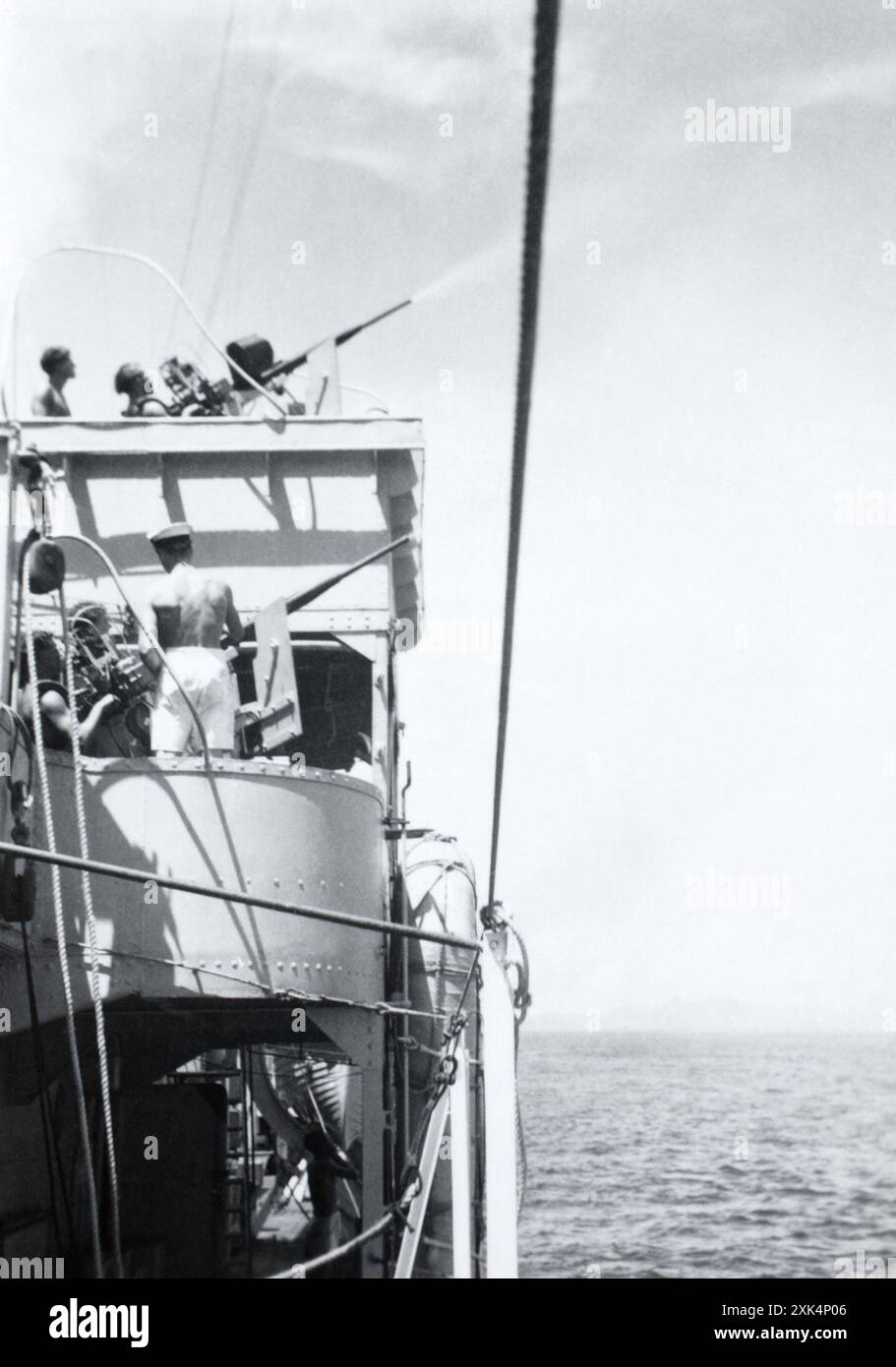 An Oerlikon 20 mm anti-aircraft gun fring from a Royal Navy ship Stock ...