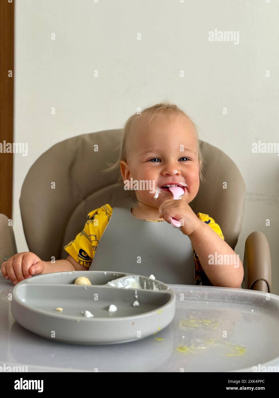 Cute child eating porridge feeding hi-res stock photography and images ...