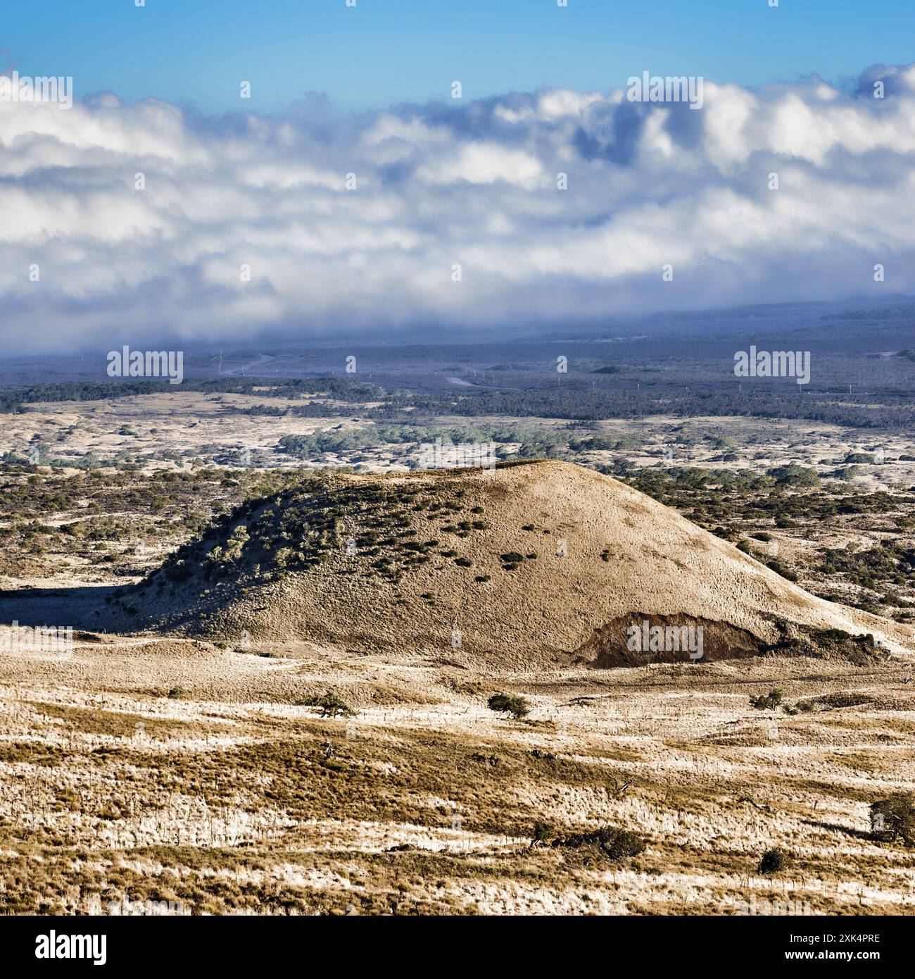 Desert, volcano and clouds in blue sky in nature with eco friendly ...