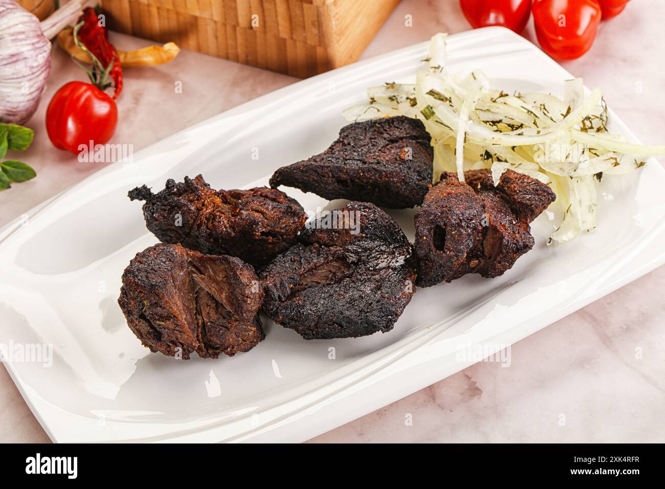Grilled beef barbecue served onion rings Stock Photo - Alamy