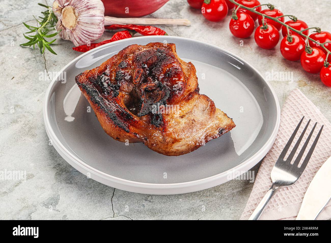 Roasted pork knuckle steak with bone Stock Photo - Alamy