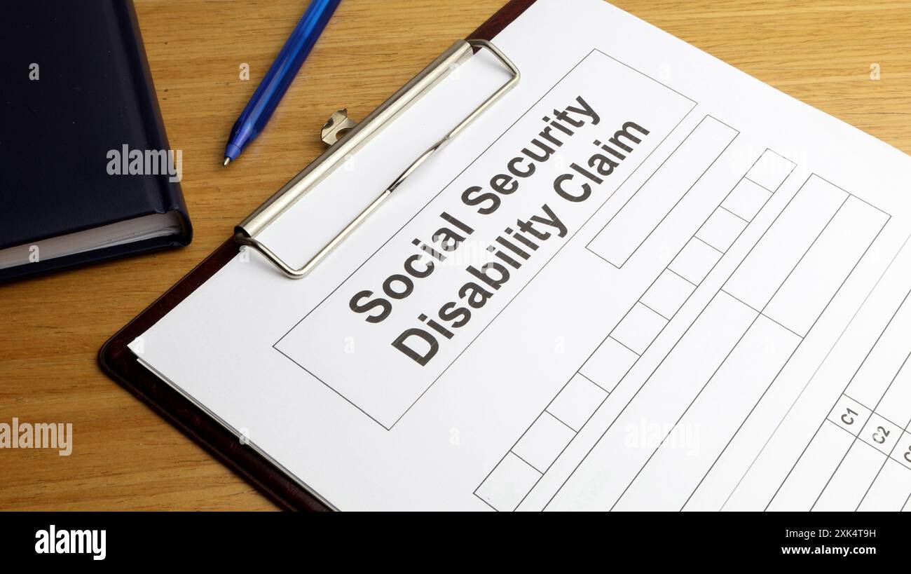 Disability claim form social security, desk with agenda and pen Stock ...