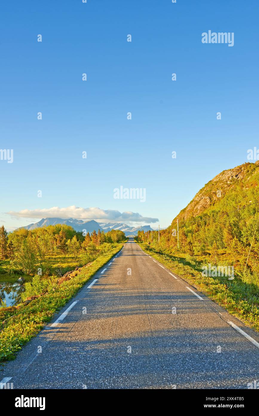 Road, blue sky and pathway to travel, outdoor and peace in environment ...