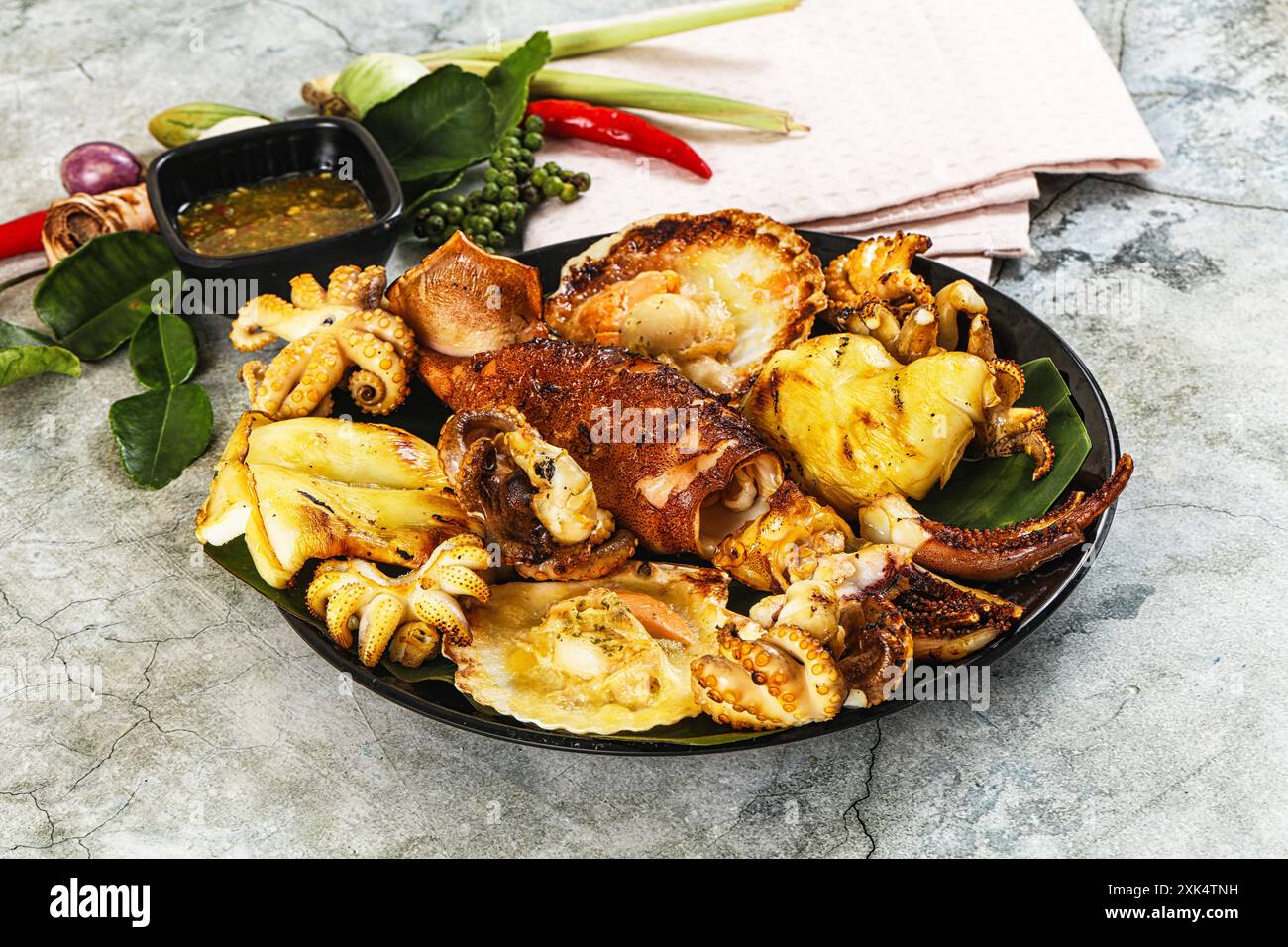Asian grilled seafood mix plate - squid, cuttlefish, scallops and ...