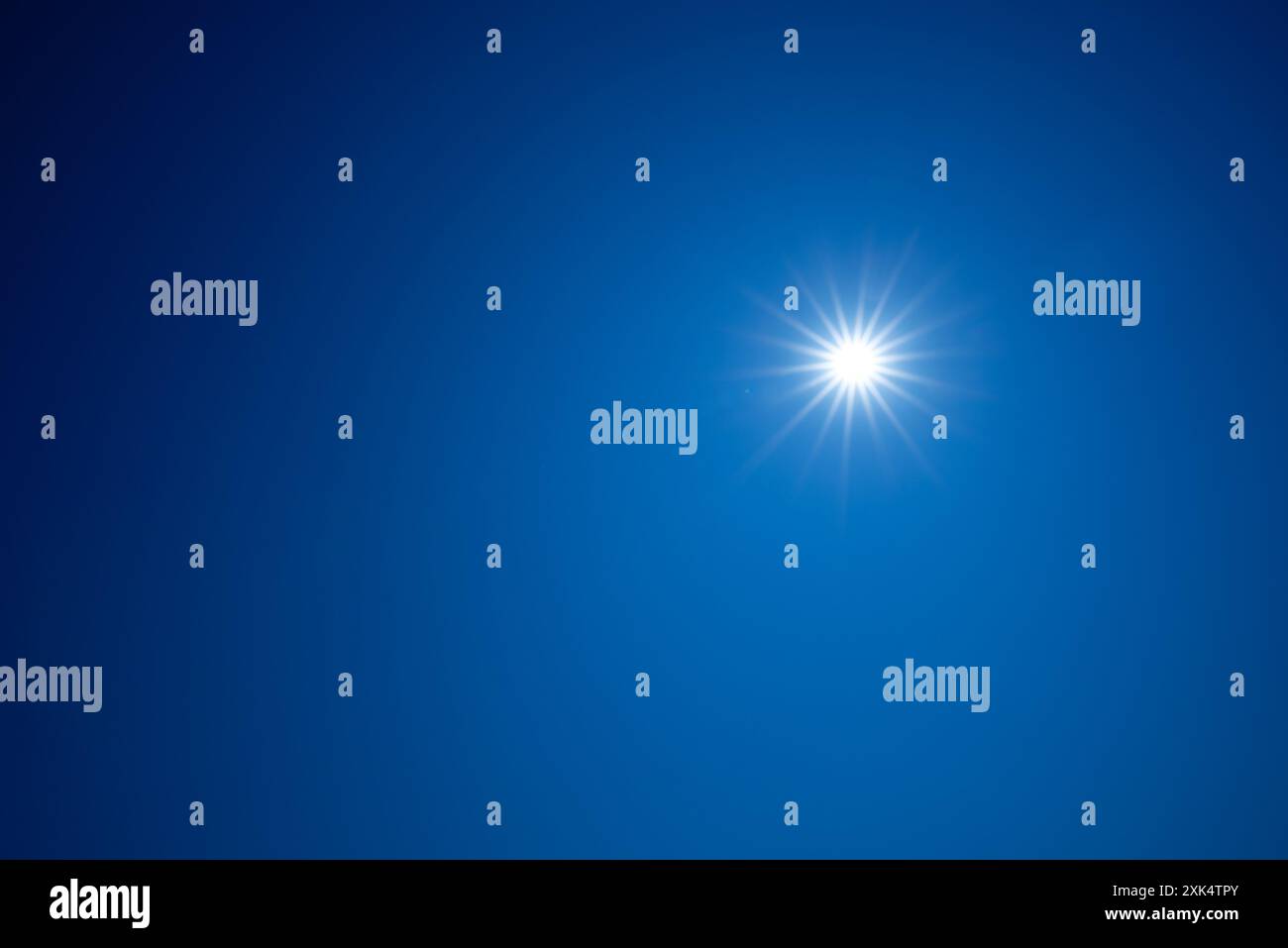 the sun high in the blue sky, noon Stock Photo - Alamy
