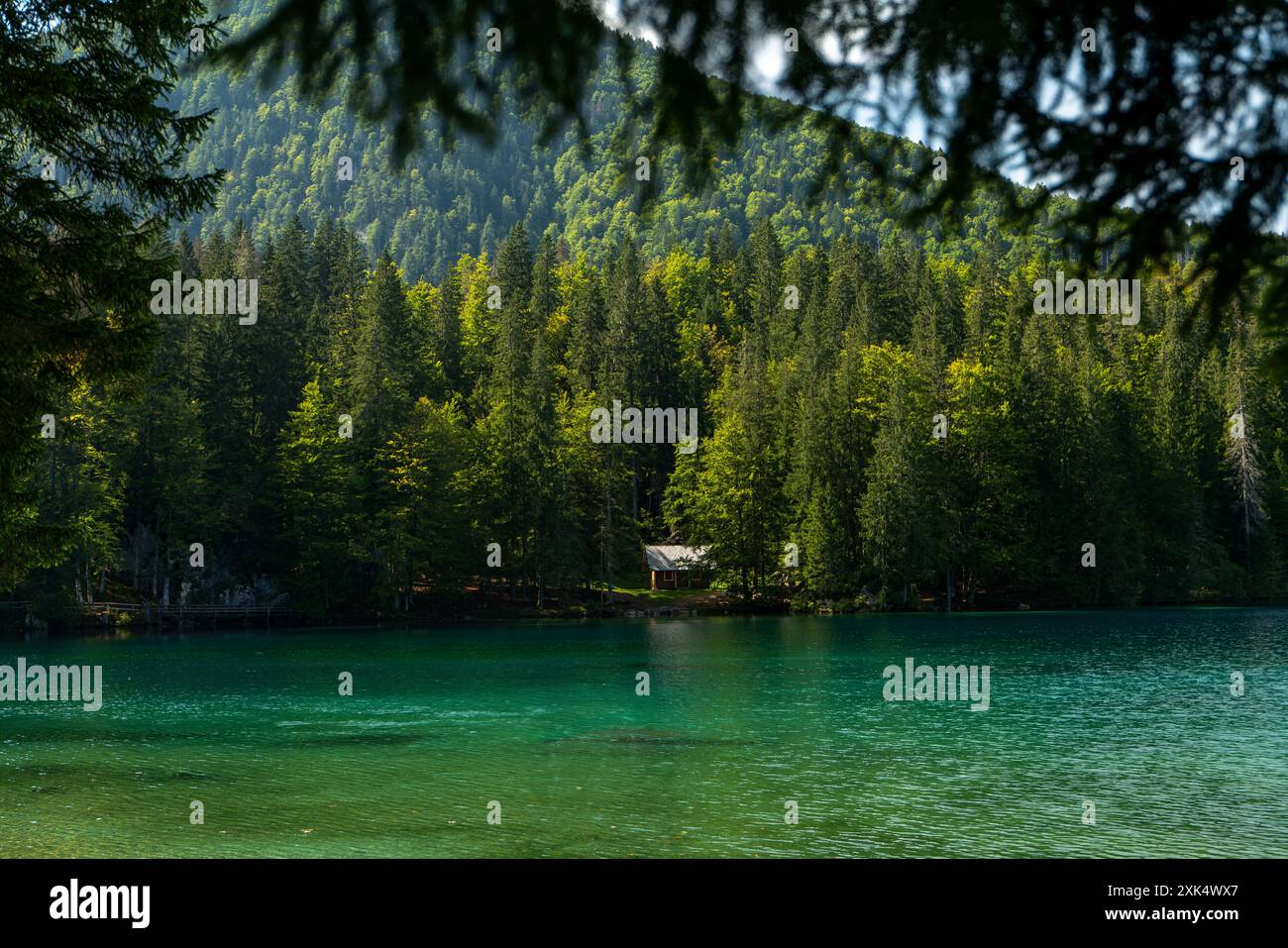 Lago Inferiore di Fusine Lake in Italy. Boat Stock Photo - Alamy