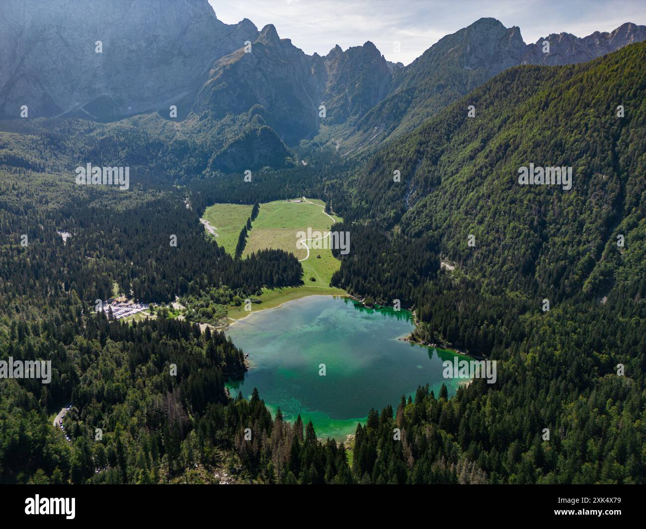 Drone shot flying. Lago Inferiore di Fusine Lake in Italy. Boat Stock ...