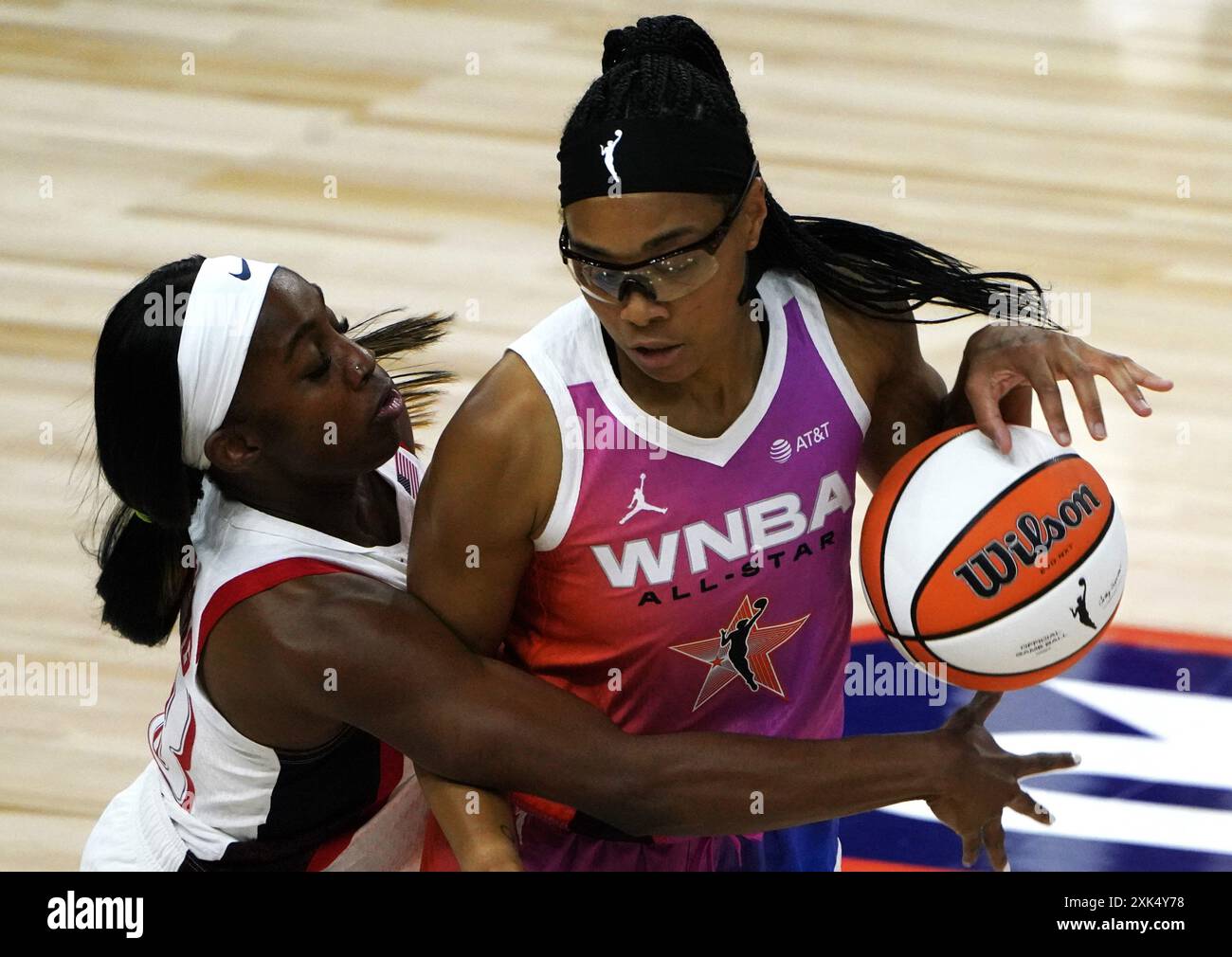 Phoenix, USA. 20th July, 2024. Allisha Gray (R) of team WNBA competes ...