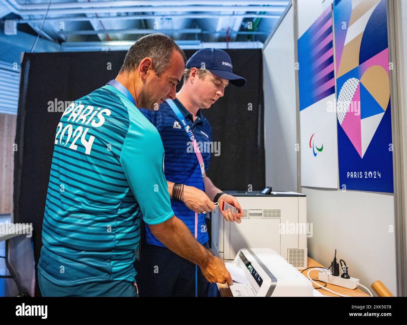 Paris, France. 19th July, 2024. A staff makes the Olympic Identity and ...