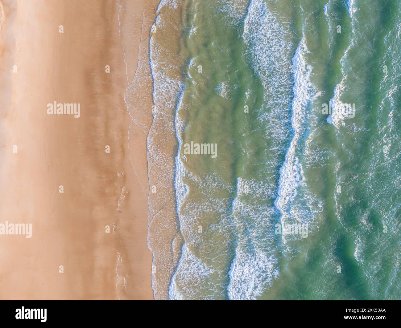 Ocean waves on the beach as a background. Aerial top down view of beach ...