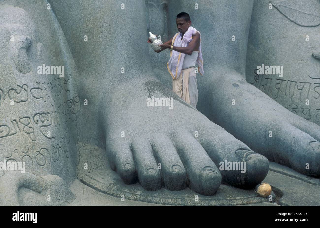 The foot of Gomateshwara Buddha Statue on the Vindhyagiri Hill in the ...