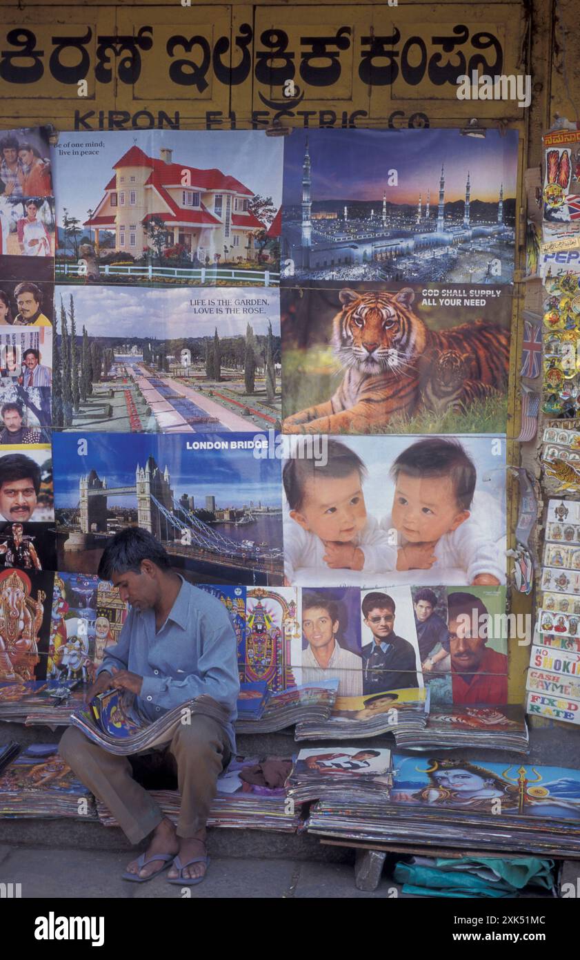 a men sales posters at a market in the city of Mysore in the Province ...