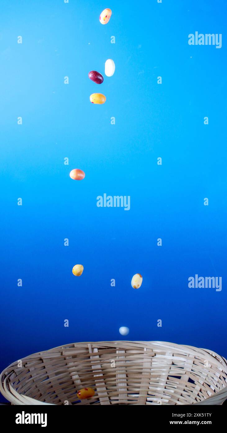 jelly babies falling in a bowl Stock Photo - Alamy