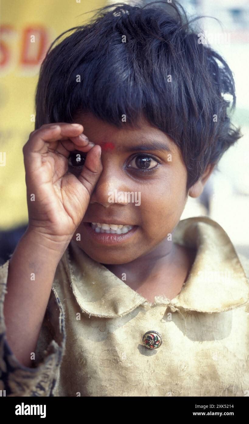 a Indian girl posing for the photografer in the city of Mysore in the ...