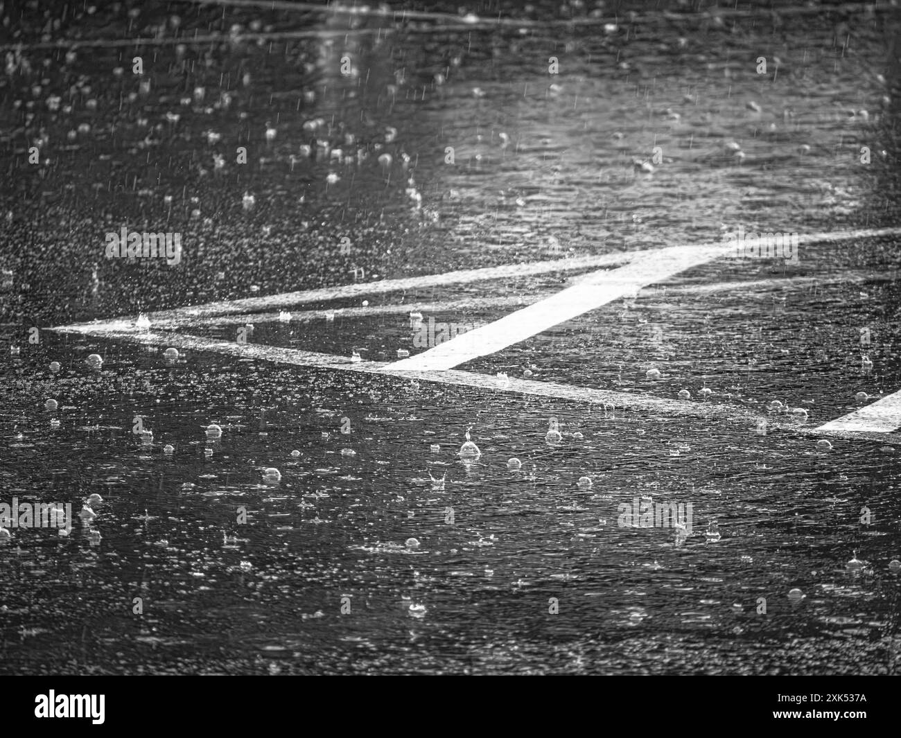 sudden summer rain in a parking lot Stock Photo - Alamy