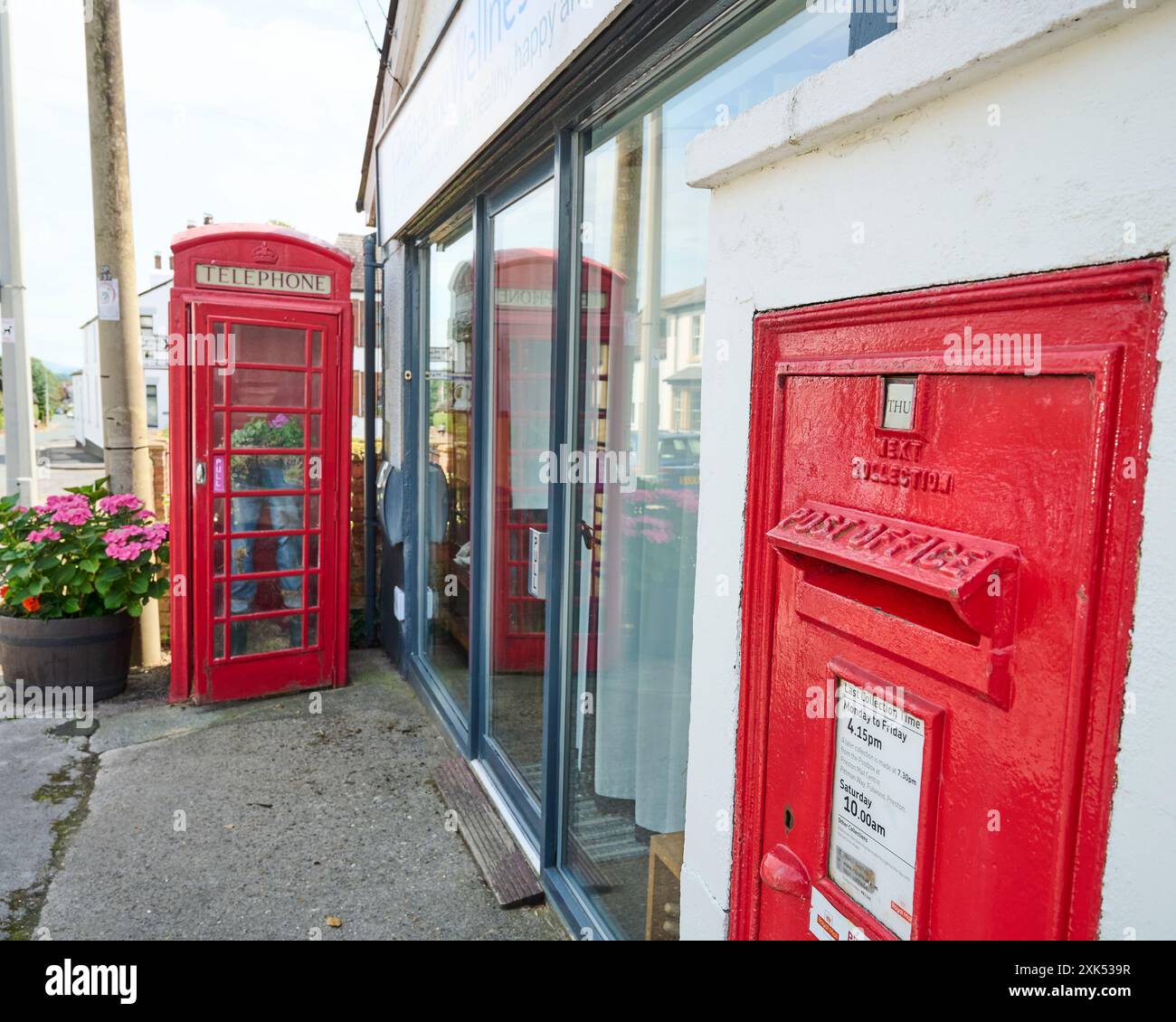 Post box and old style (K6) red phone box(grade 2 listed) outside ...