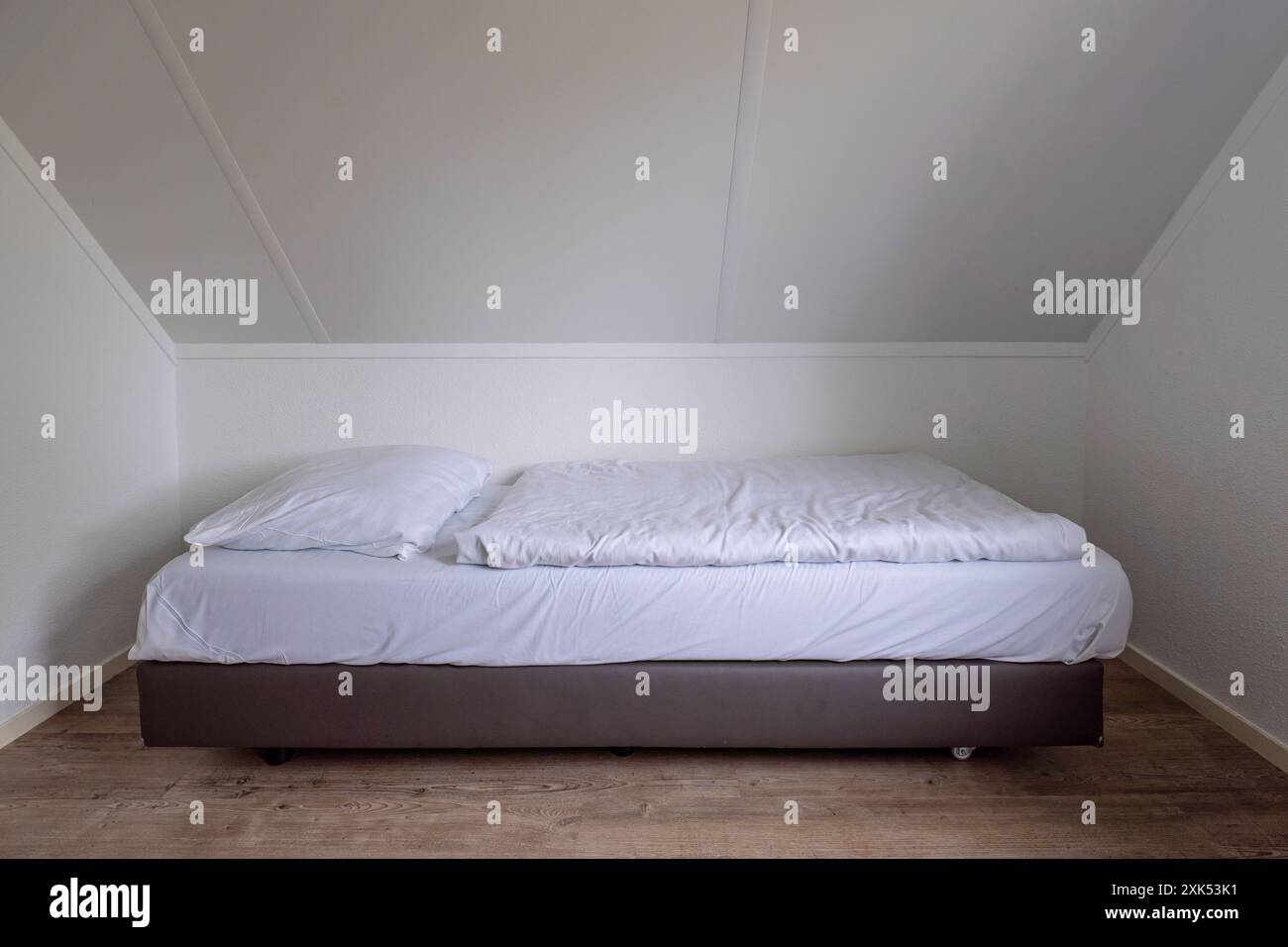 bed in an attic room Stock Photo - Alamy