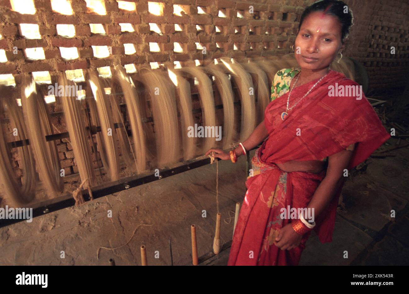 a women at a Family spinning Factory of sheep Textile wool at work in ...
