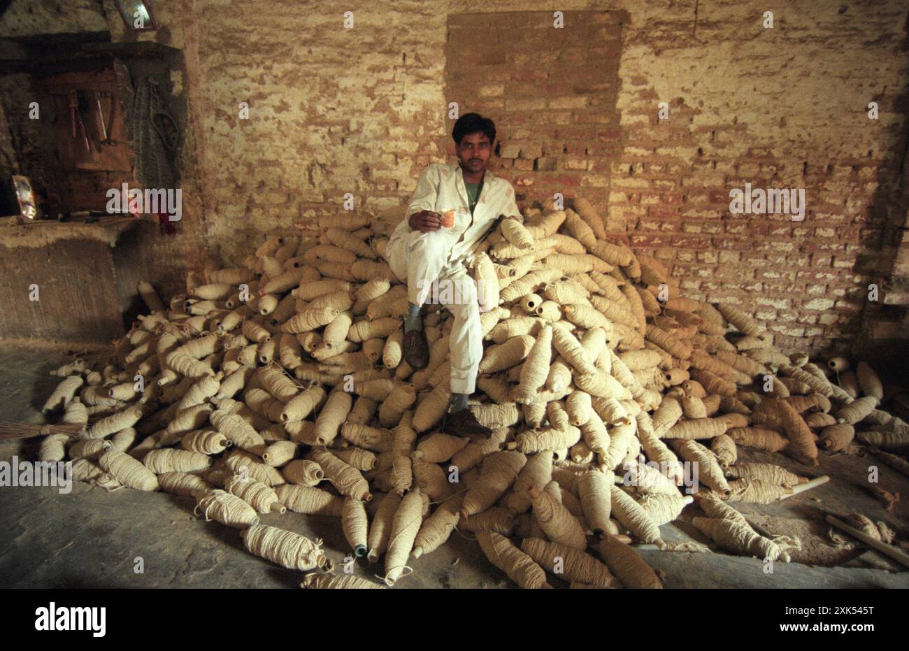 men at a Family spinning Factory of sheep Textile wool at work in the ...
