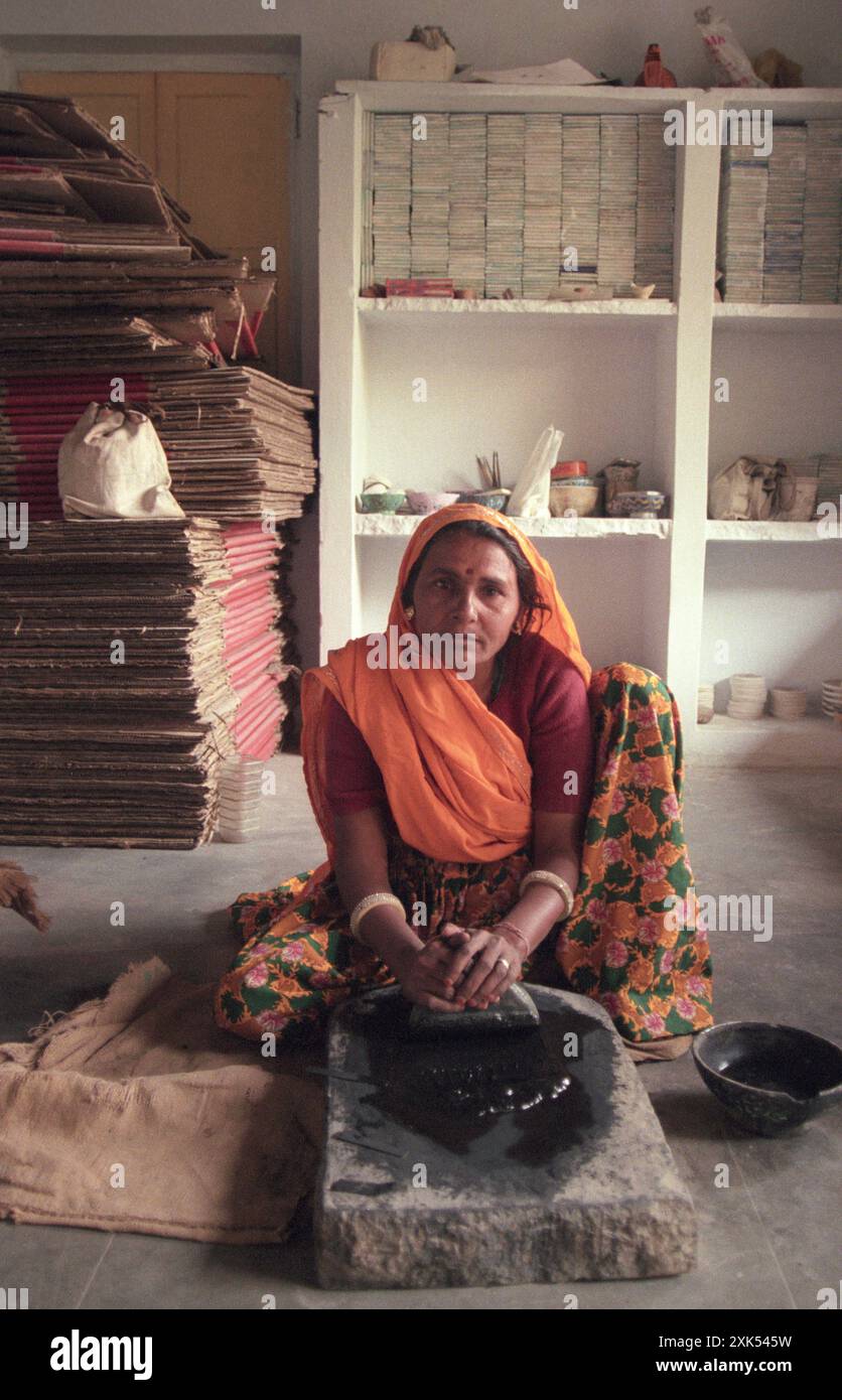 a women at a Family Factory of hand made Batik Textile print at work in ...