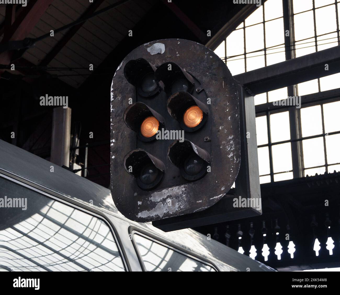 Orange light on railway semaphore. Overhead railway signal at railway ...