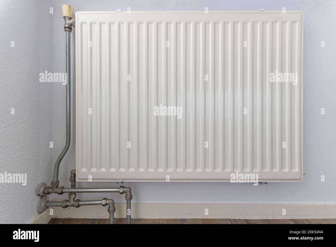wall mounted radiator with valve Stock Photo - Alamy