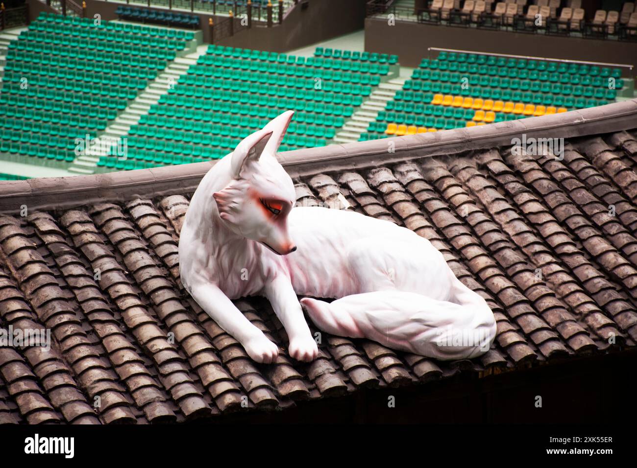 White fox statue on antique building architecture of stage theater ...