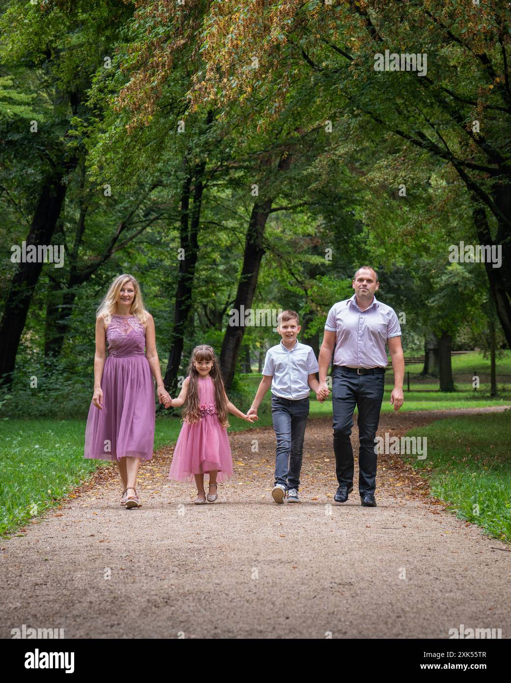 Portrait of a happy family. Laughing dad and mom, teenage son and first ...
