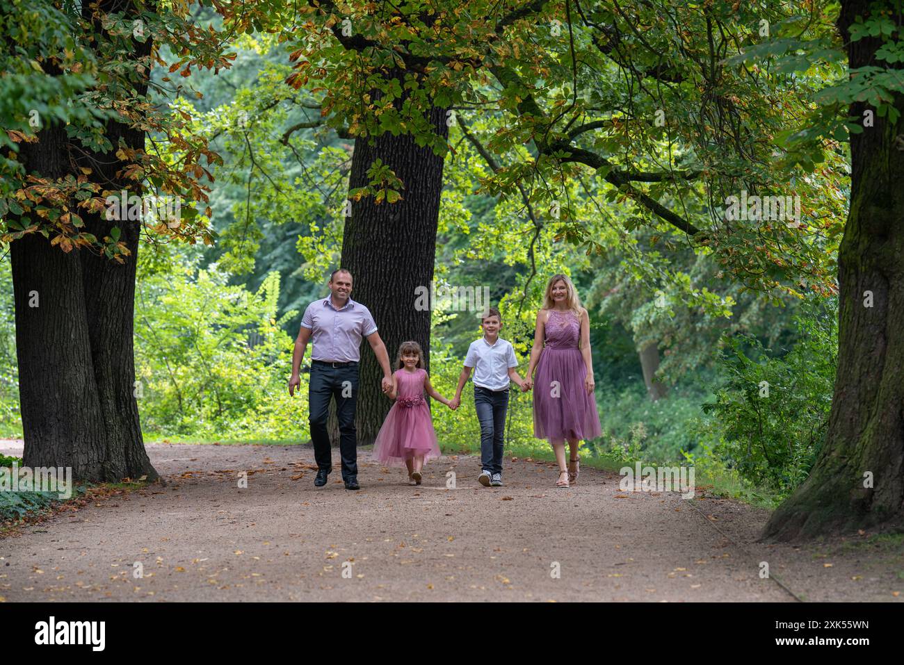 Portrait of a happy family. Laughing dad and mom, teenage son and first ...