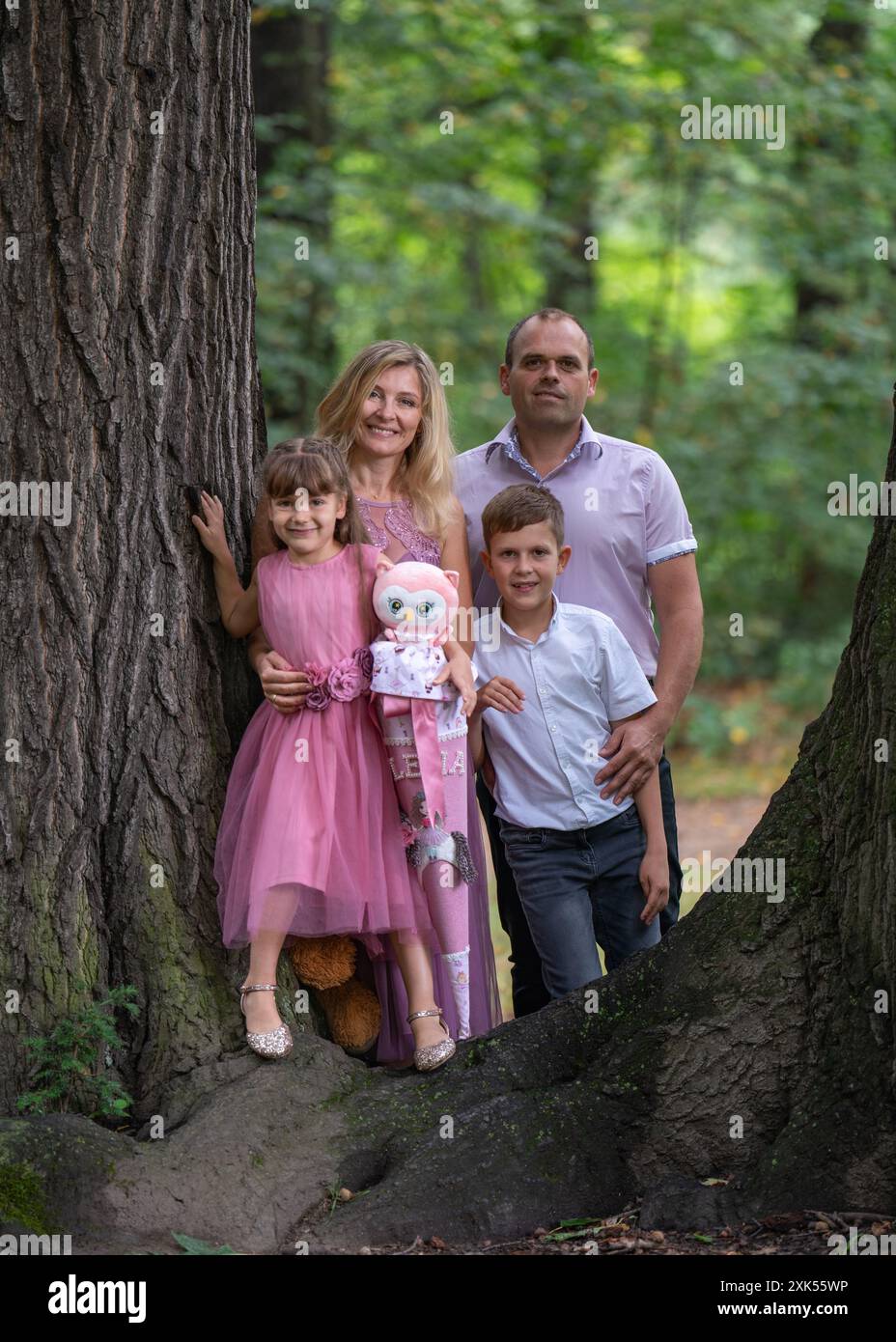 Portrait of a happy family. A laughing father and mother, a teenage son ...
