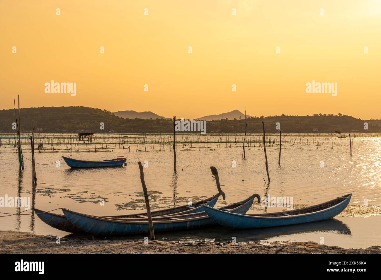 Traditional boats at O Loan lagoon in sunset, Phu Yen province, Vietnam ...