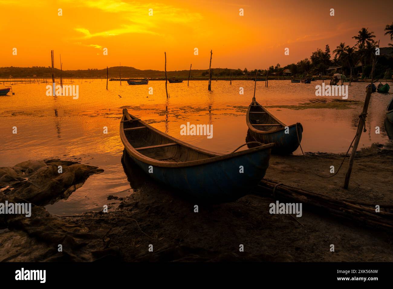 Traditional boats at O Loan lagoon in sunset, Phu Yen province, Vietnam ...
