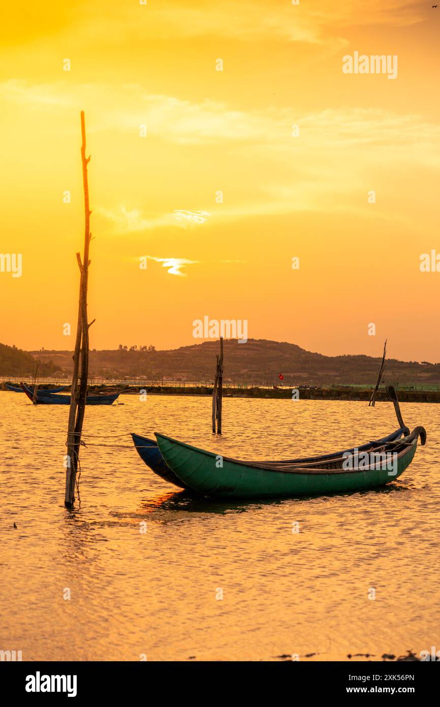 Traditional boats at O Loan lagoon in sunset, Phu Yen province, Vietnam ...