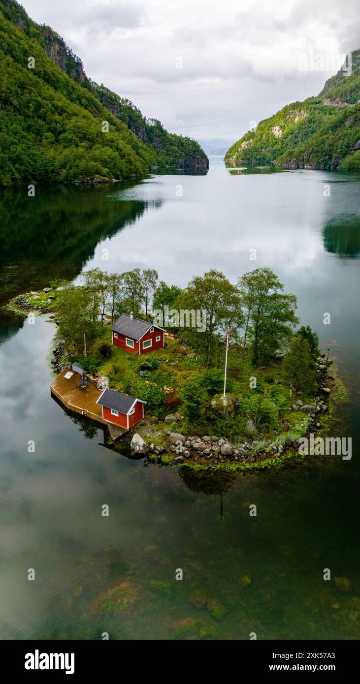 Red house on a fjord in norway with flag hi-res stock photography and ...