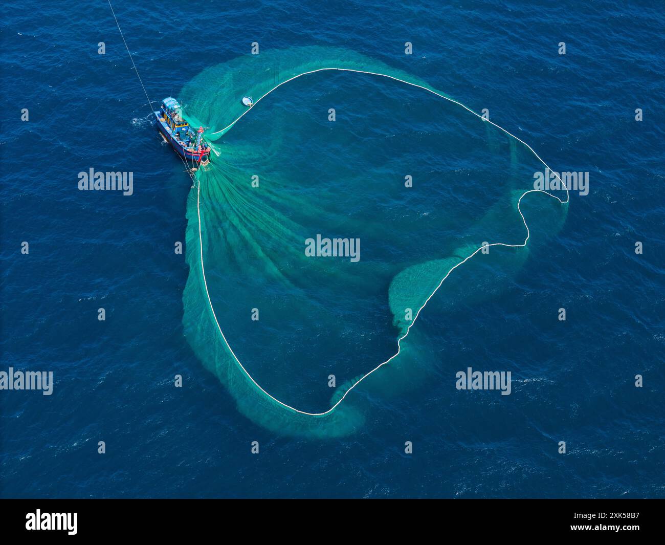 Aerial view of traditional wooden boat and fishermen are fishing ...