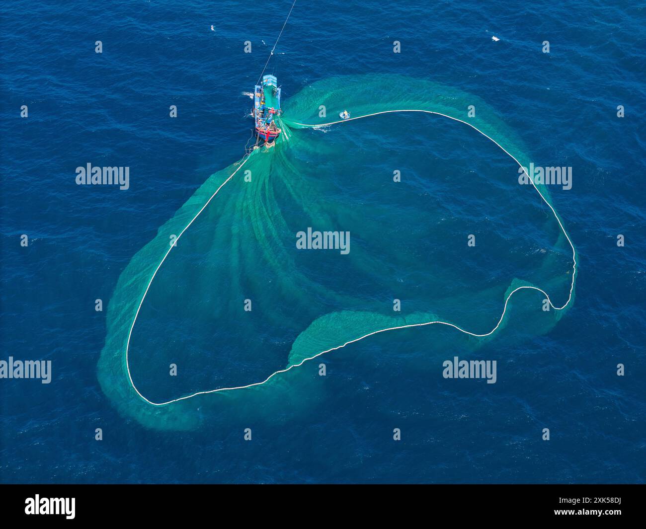 Aerial view of traditional wooden boat and fishermen are fishing ...
