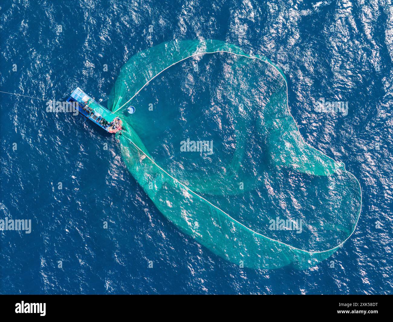 Aerial view of traditional wooden boat and fishermen are fishing ...