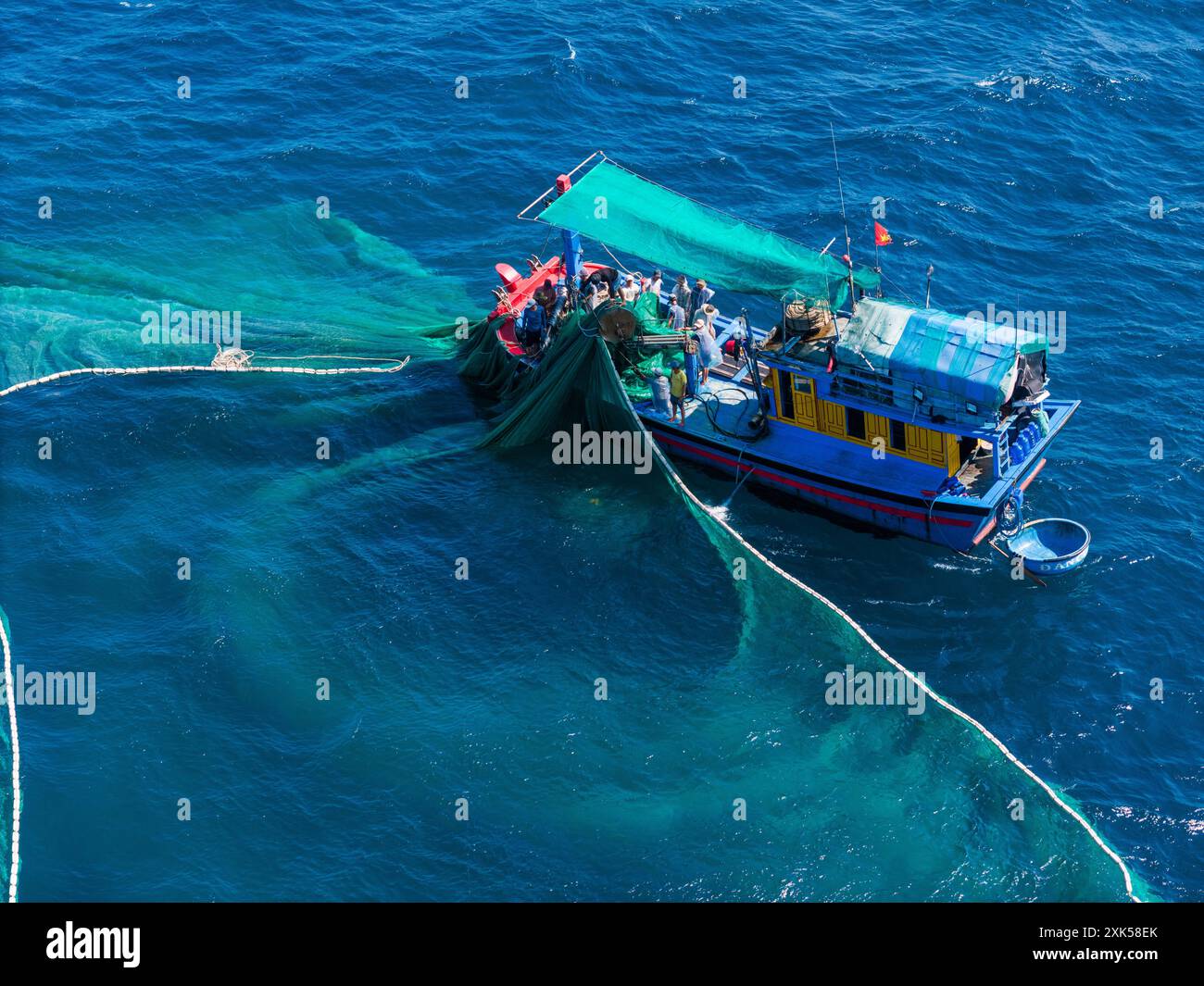 Aerial view of traditional wooden boat and fishermen are fishing ...