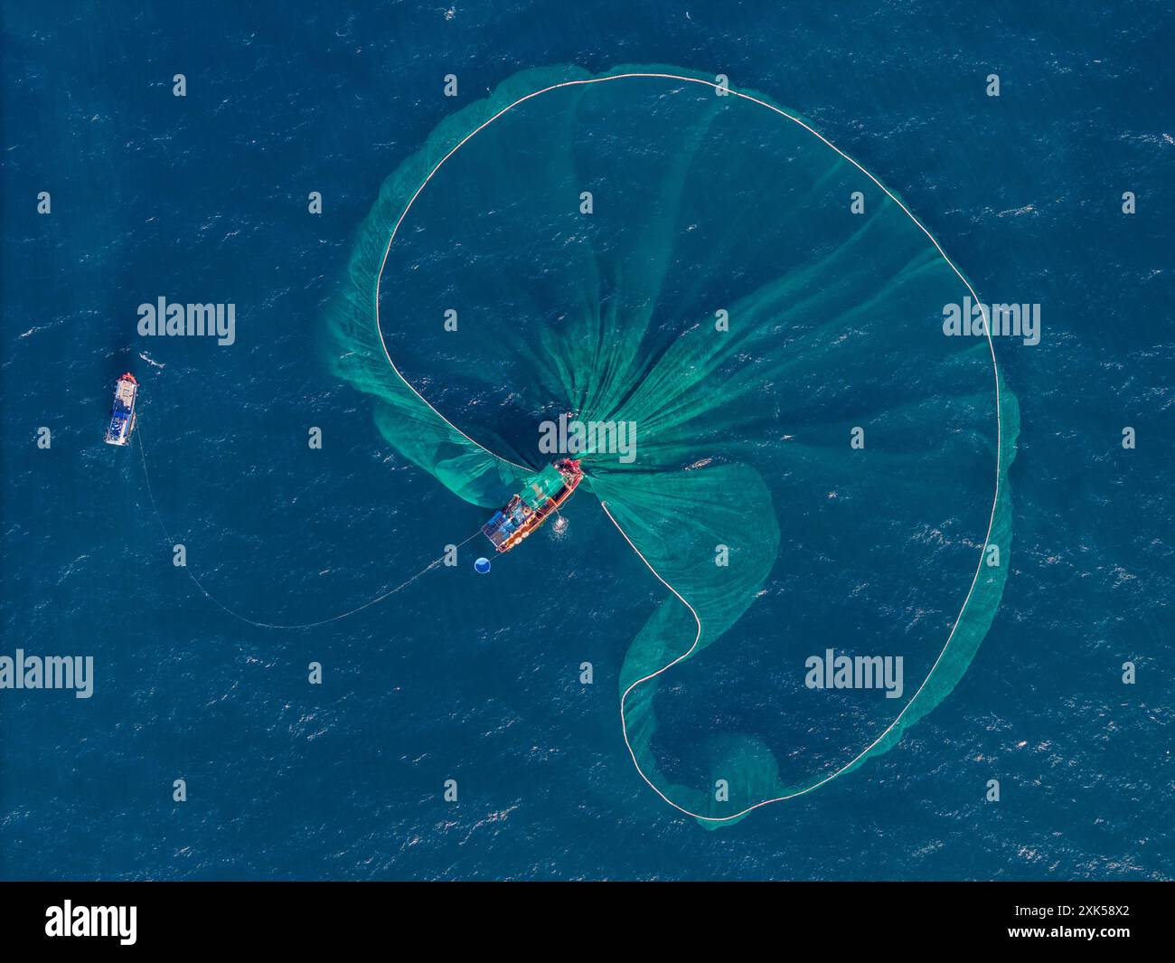 Aerial view of traditional wooden boat and fishermen are fishing ...