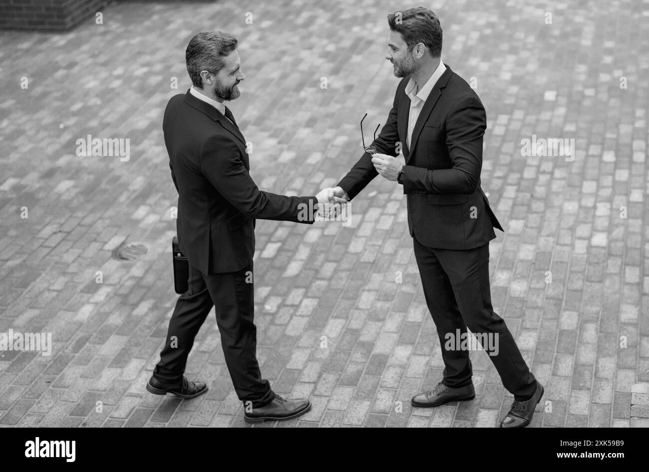 Business men have a meeting outside. Business man shaking hands. Two ...