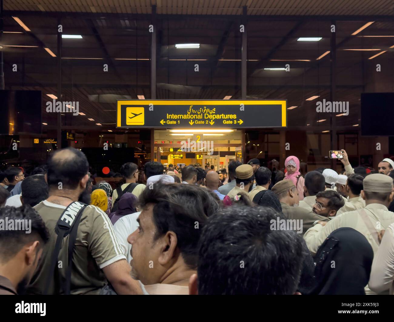 Travelers Umrah Pilgrims at Karachi airport departure gate Stock Photo ...